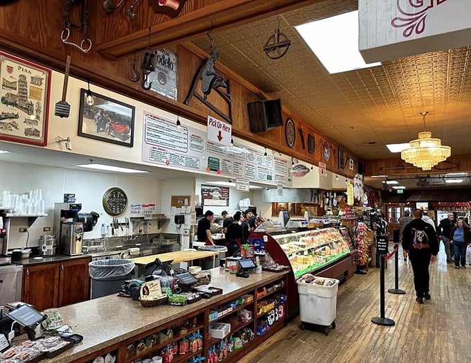 The bustling deli counter – where sandwiches are built with architectural precision and the display case tempts you to take home more than you planned.