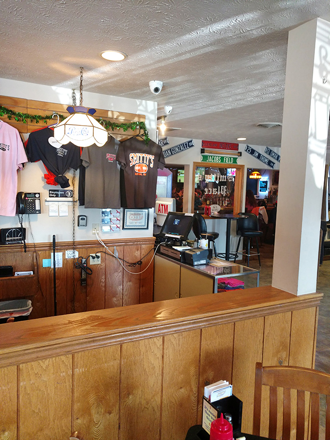 The counter area showcases local pride with pennants and memorabilia—a mini museum of community spirit alongside the cash register.