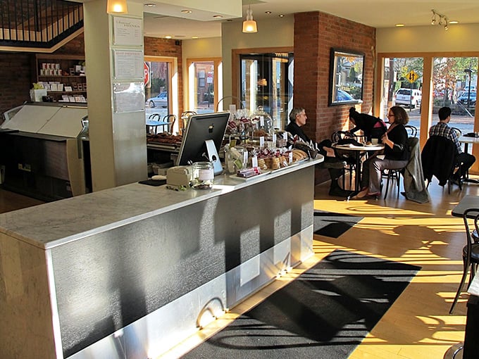 Morning light streams across the counter, illuminating both pastries and the faces of those about to experience bliss.