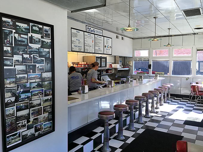 That row of counter stools isn't just functional—it's a front-row seat to the culinary theater where breakfast dreams are made real.