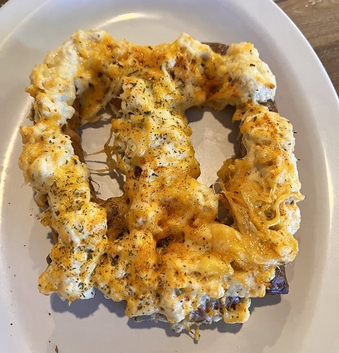 The crab pretzel represents Maryland ingenuity at its finest—a twisted collaboration of soft pretzel, creamy crab dip, and melted cheese that defies conventional snacking.