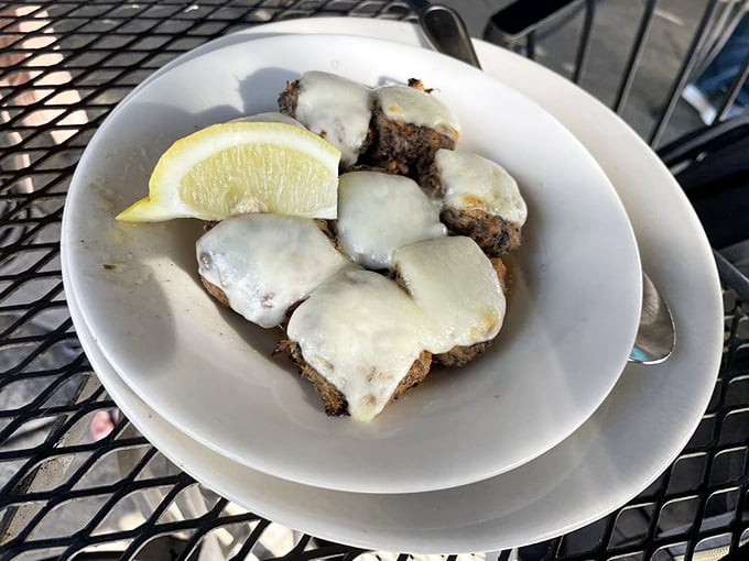 Crab-stuffed mushrooms under a blanket of melted cheese with a squeeze of lemon—little umami bombs that disappear from the plate mysteriously fast.