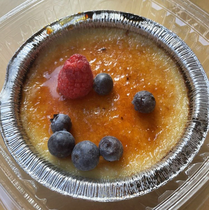This crème brûlée with its perfectly torched top isn't just dessert – it's a delicious game of "crack and discover" with a berry bonus.