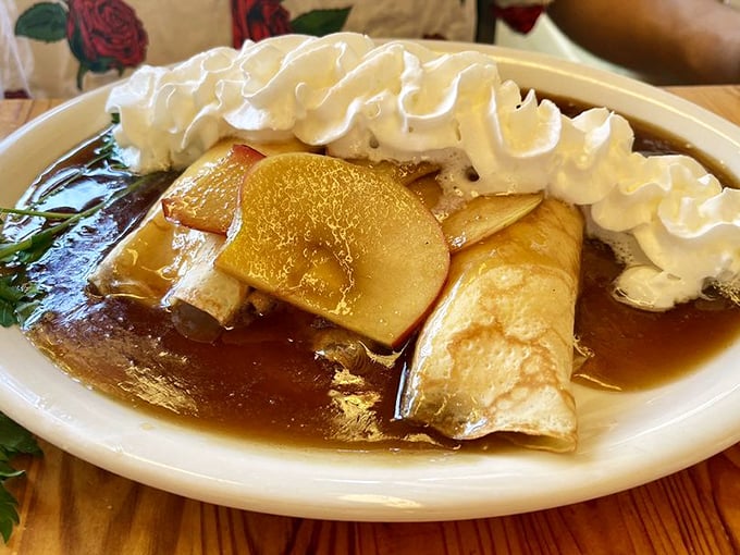 These crepes with caramelized apples and whipped cream aren't just breakfast—they're what dessert dreams about at night.