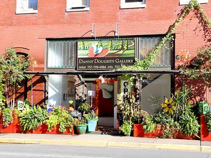 Danny Doughty Gallery bursts with color and creativity. Those plants aren't just decoration—they're a preview of the vibrant life inside.