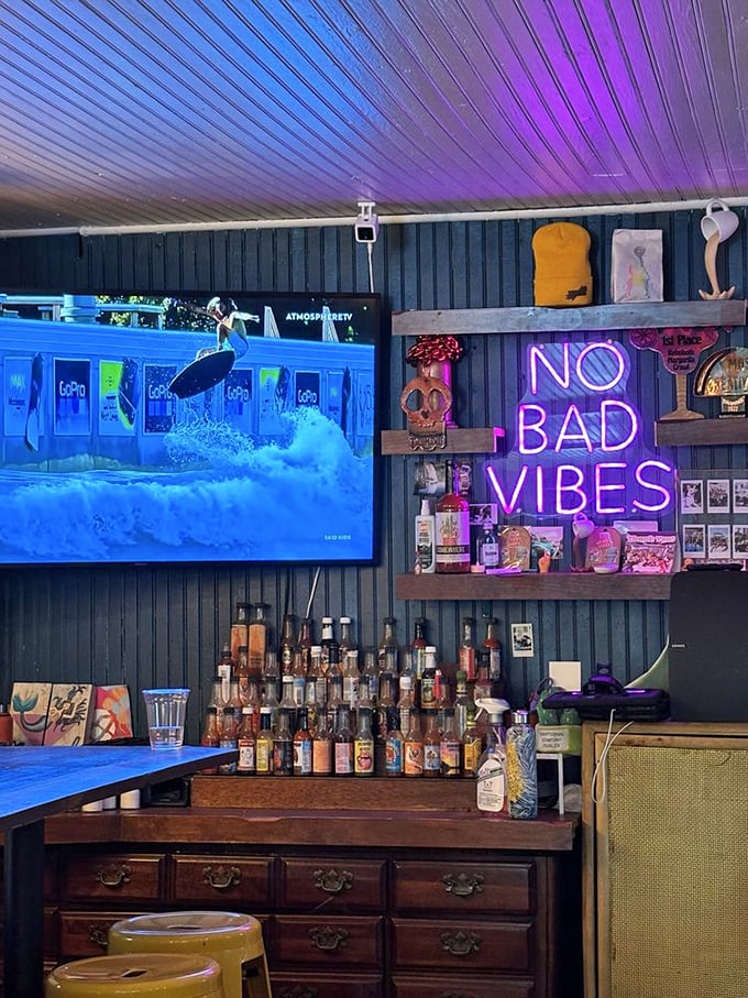 The bar area's pink-purple glow transforms evening drinks into a scene from your favorite indie film—casual cool without trying too hard.