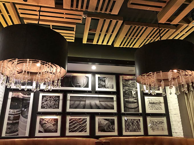 The ceiling's artistic wooden slats draw your eye upward to dramatic lighting fixtures that resemble cascading teardrops of crystal.