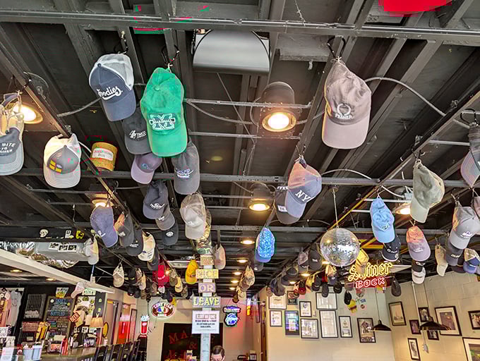 Hats from a thousand stories hang from the ceiling, silent witnesses to countless first dates, family meals, and food epiphanies.
