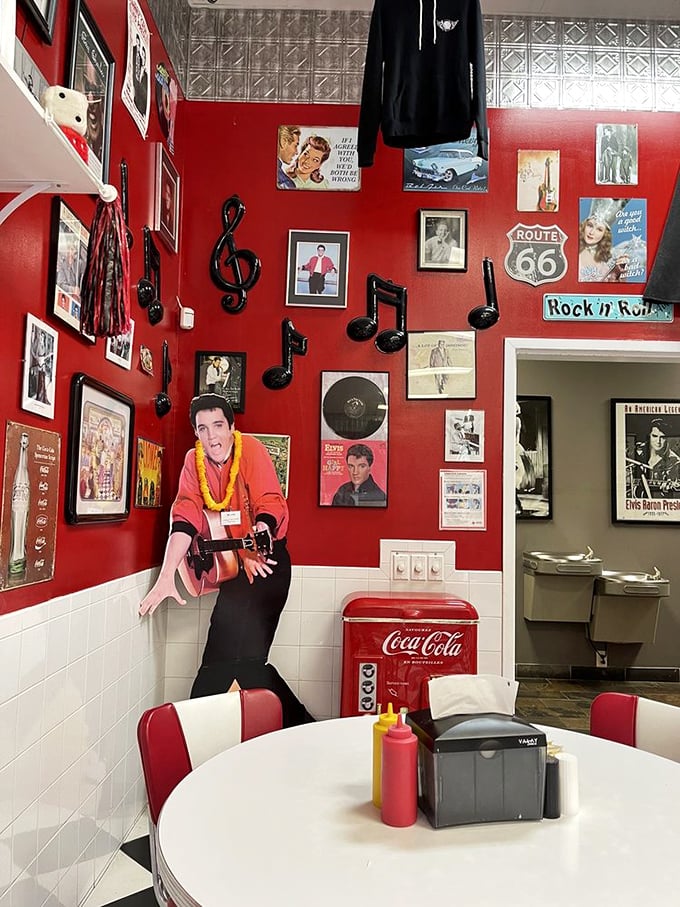 Elvis watches over diners from his place of honor—because even The King would skip Graceland for a meal at this roadside temple of comfort.