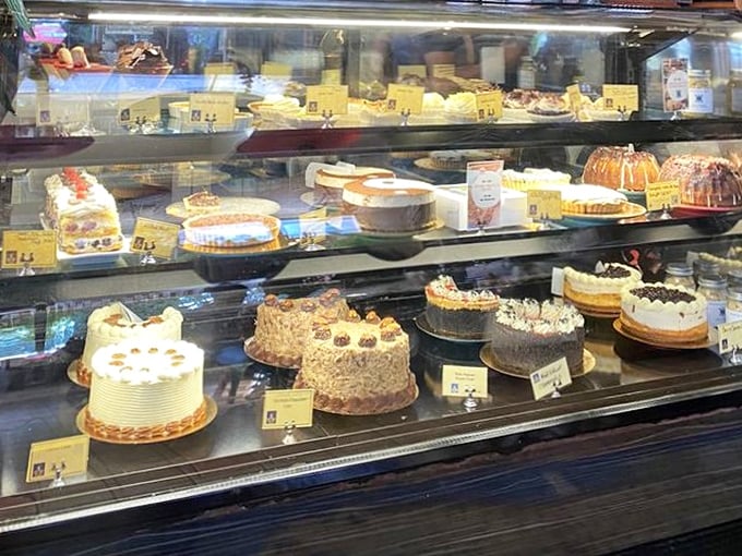 The dessert case—a glass-enclosed gallery of temptation where willpower goes to die and "I'll just have a bite" becomes a beautiful lie.