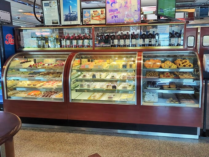 The dessert case—where willpower goes to die and "I'll just have coffee" turns into "I'll have that chocolate cake, please."