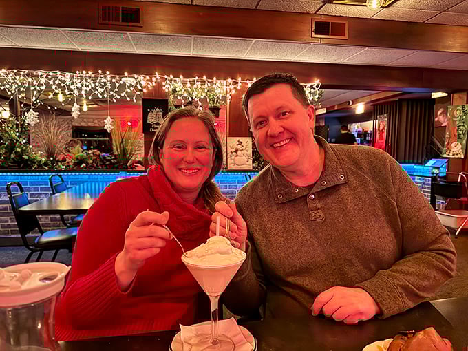 The image shows patrons enjoying what appears to be a dessert drink, capturing the convivial atmosphere that makes supper clubs special gathering places.