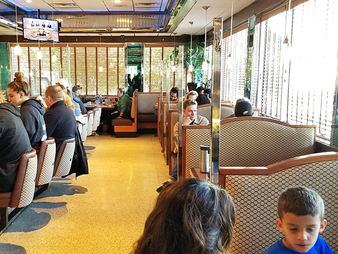 The dining room hums with conversation and clinking silverware—a community gathering place where strangers become neighbors over coffee refills.