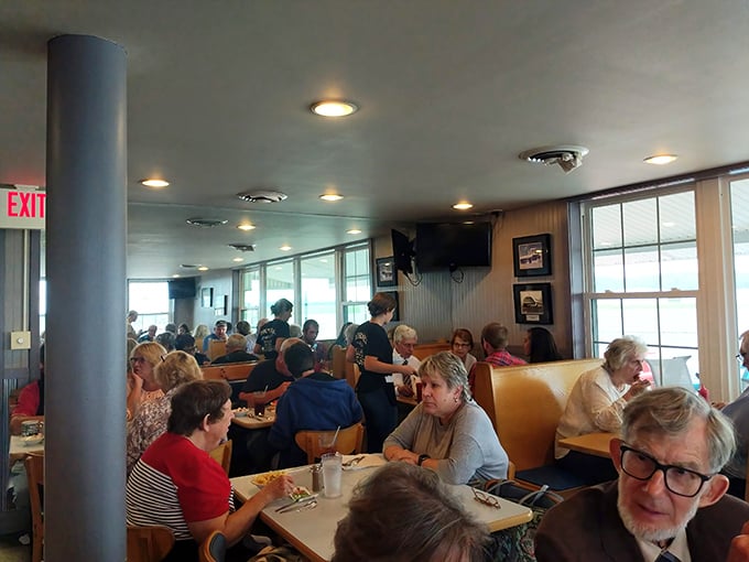 A full house is the best review any restaurant could ask for. These diners aren't just eating—they're participating in a community tradition.