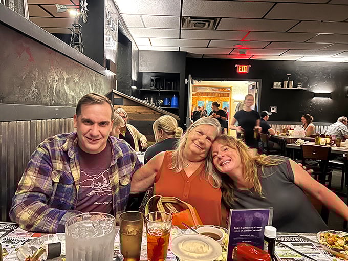Happy diners sharing laughs and stories—the universal language of supper club camaraderie that makes every table feel like home.