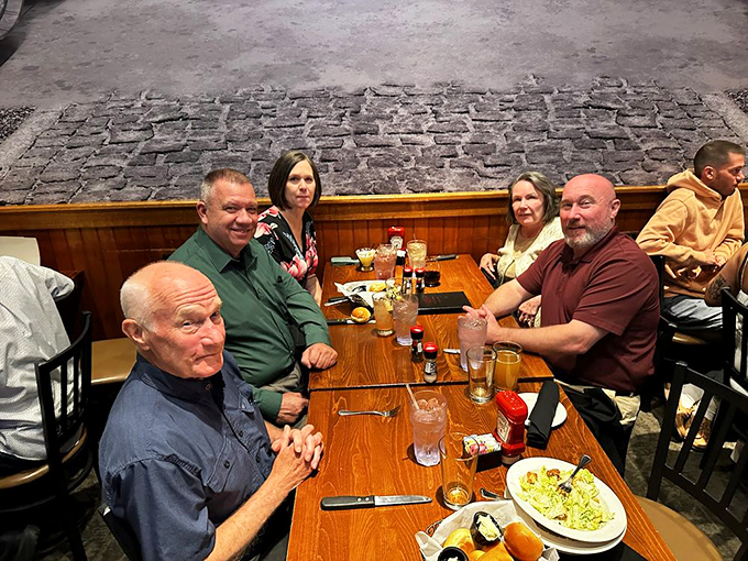 Happy diners gathered around a table – the universal sign of a restaurant worth visiting. Conversations flow as freely as the iced tea.