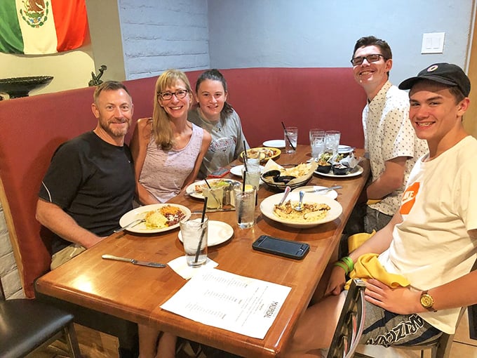 The universal language of good food bringing people together around the table. Those smiles tell you everything you need to know about the meal.
