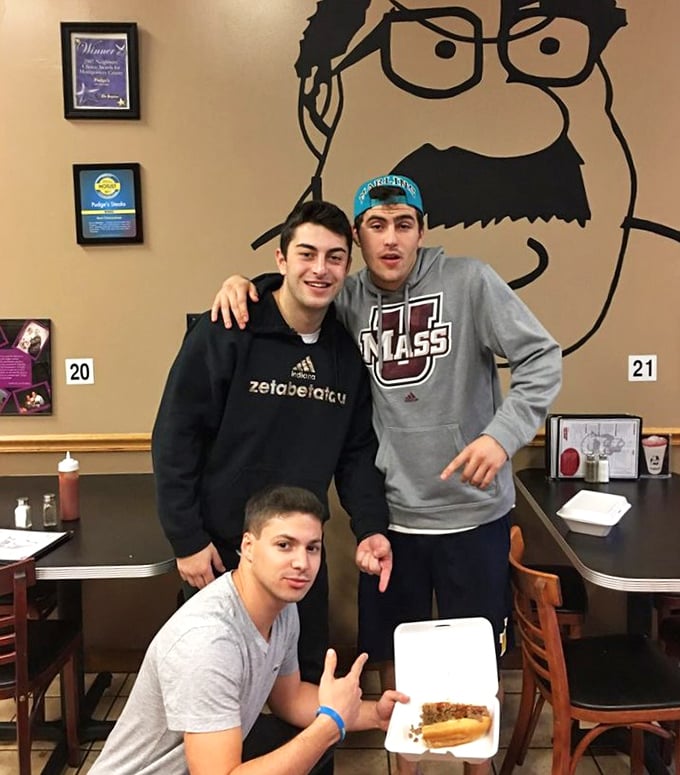 The wall art watches over happy diners enjoying their conquest. Nothing brings people together like the shared experience of sandwich excellence.