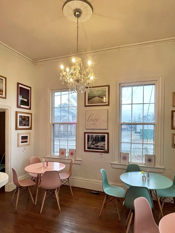 Dining room elegance with a touch of whimsy—pastel chairs, crystal chandelier, and windows that flood the space with Tennessee sunshine.