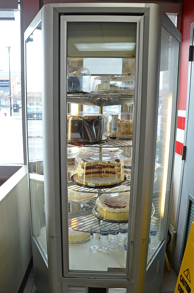 The dessert case – a glass-enclosed temple of temptation where willpower goes to die and diet plans are forgotten.