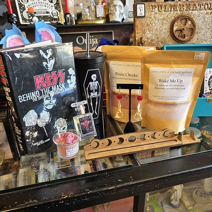 The counter where impulse purchases are born—KISS memorabilia meets bath products in a retail relationship that somehow makes perfect, peculiar sense.