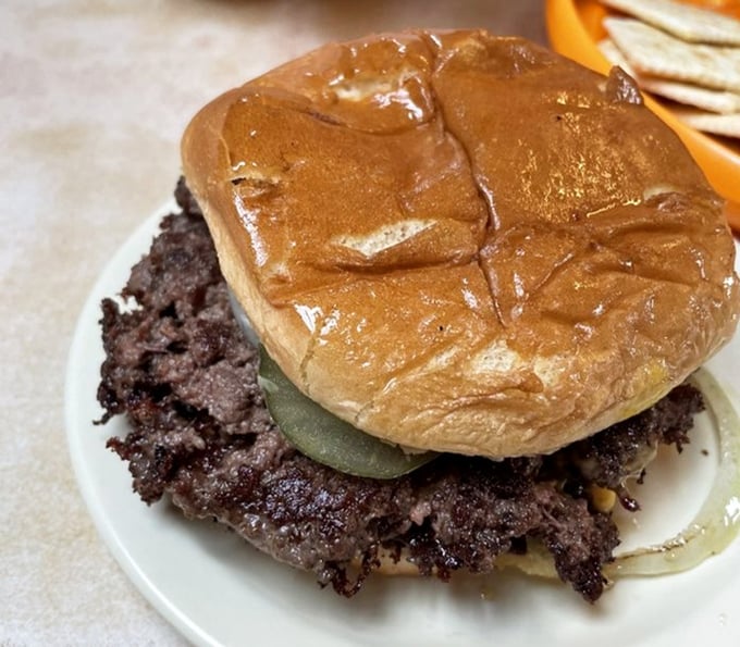 This burger doesn't need fancy aioli or artisanal buns—it's the high school football star who never left town but still draws crowds on Friday nights.
