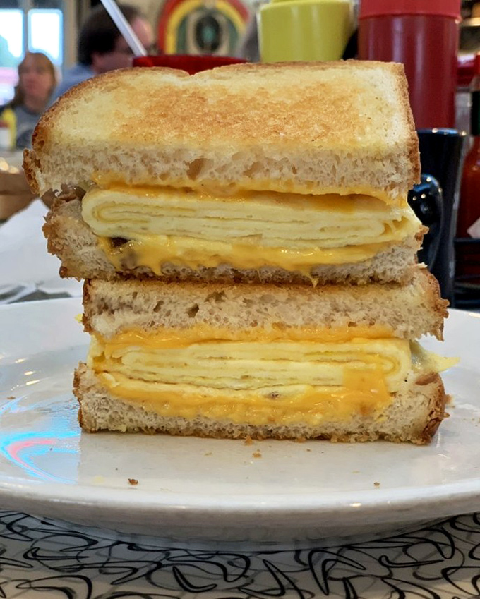 This egg and cheese sandwich isn't just breakfast—it's morning salvation between two perfectly toasted slices of bread that understand your needs.