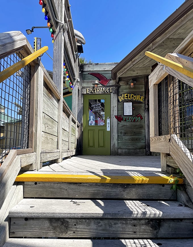 A weathered wooden entrance with colorful accents – like walking into a friend's beach house, if your friend happened to serve unlimited shrimp.