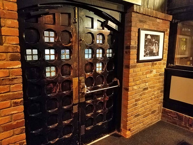 These aren't just doors – they're a portal to the promised land of prime beef and impeccable service. The brick says "historic," but your stomach says "hurry."