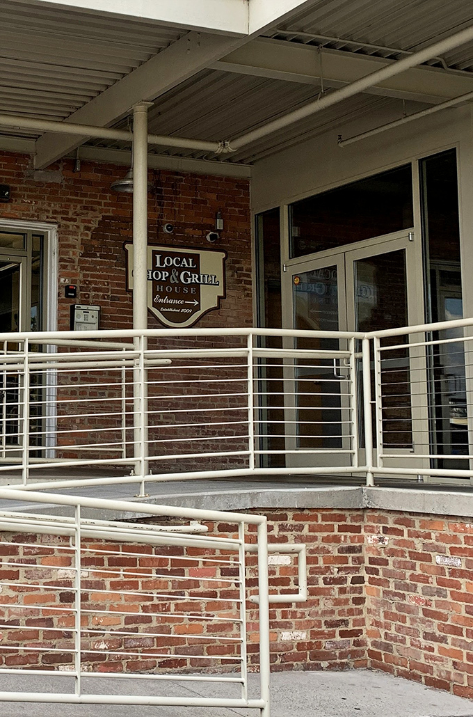 The entrance that promises delicious adventures ahead. Simple signage on historic brick—because when your reputation is this good, you don't need neon lights.