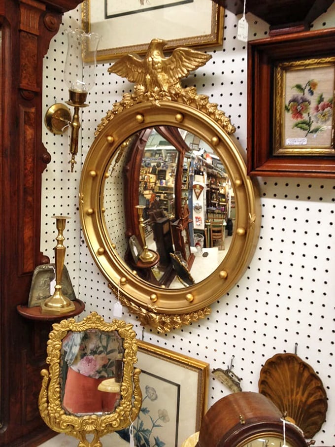 This Federal-style gilded mirror doesn't just reflect your face—it reflects two centuries of American craftsmanship and possibly a few ghostly shoppers from antiques past.