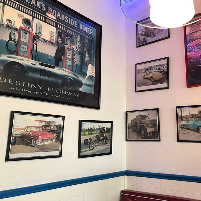 Classic car photos and vintage advertisements line the walls – a gallery exhibition of American pop culture's greatest hits.