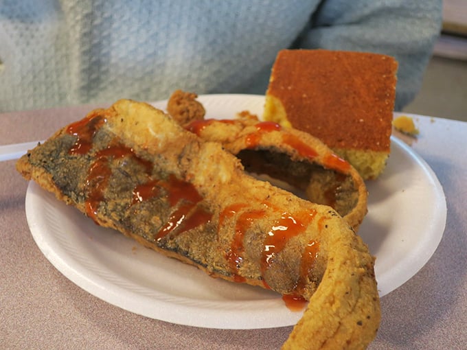 Crispy fried fish with a side of cornbread—proof that simple pleasures, when done right, can be the most profound.