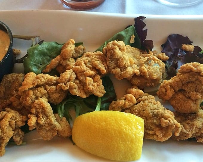 Fried oysters that crackle with cornmeal coating, while maintaining their ocean-kissed tenderness within—the seafood equivalent of a perfect contradiction.