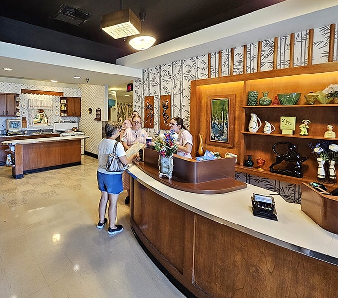 The reception area doesn't just welcome you—it adopts you. Wood paneling and vintage knick-knacks set the stage for the family dinner theater to come.