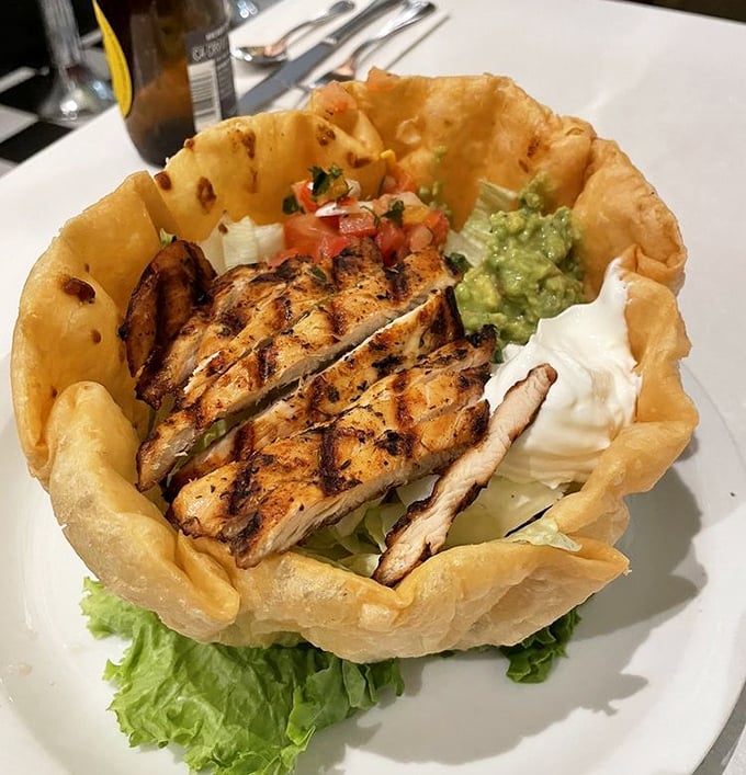This tostada isn't just a meal—it's edible engineering. A crispy foundation supporting layers of flavor that defy gravity.
