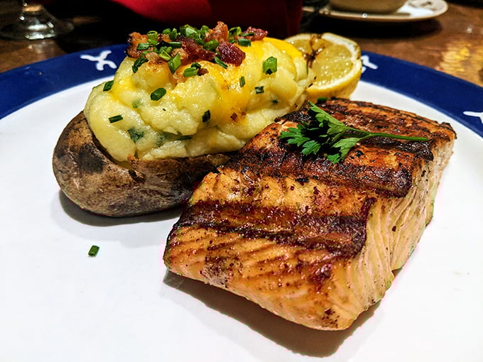 The salmon bears the perfect grill marks of a kitchen that respects seafood. That loaded baked potato is the wingman no entrée deserves but everyone needs.