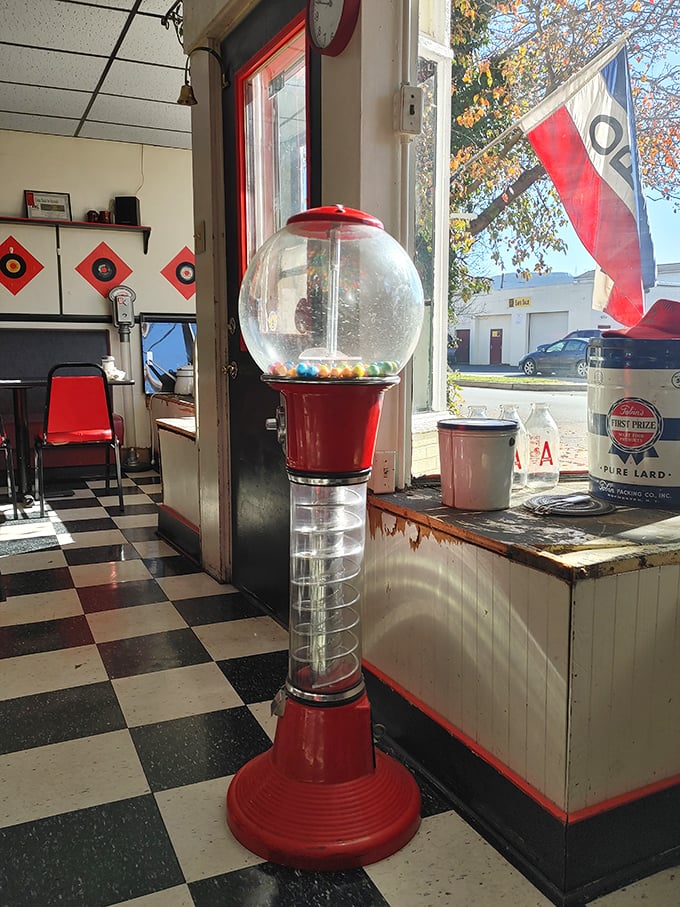 That vintage gumball machine isn't retro decoration—it's a survivor from when a quarter bought both candy and a moment of childhood joy.