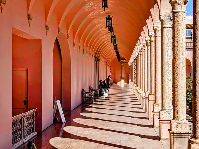 The mansion's covered walkway creates a rhythm of light and shadow that's hypnotic—architecture that's both shelter and visual poetry.
