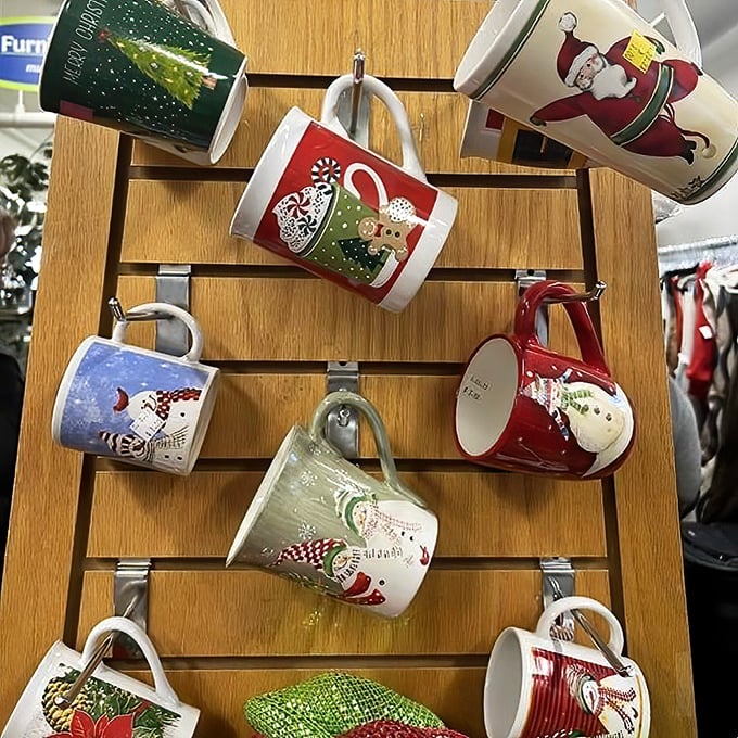 Holiday mugs hanging like festive ornaments—because nothing says "seasonal cheer" like drinking cocoa from someone else's former Christmas favorite.