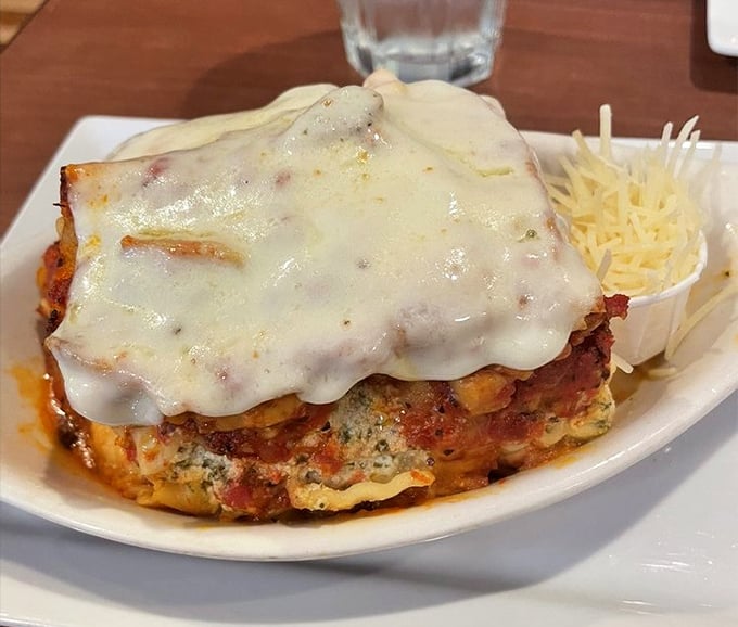 Lasagna that doesn't understand the concept of personal space – layers of cheese, sauce, and pasta in a beautiful boundary-crossing mess. Fork-ready comfort.