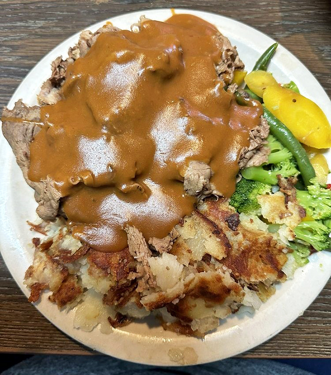 This hot sirloin sandwich isn't just lunch – it's therapy on a plate. The gravy alone could solve most of life's problems.