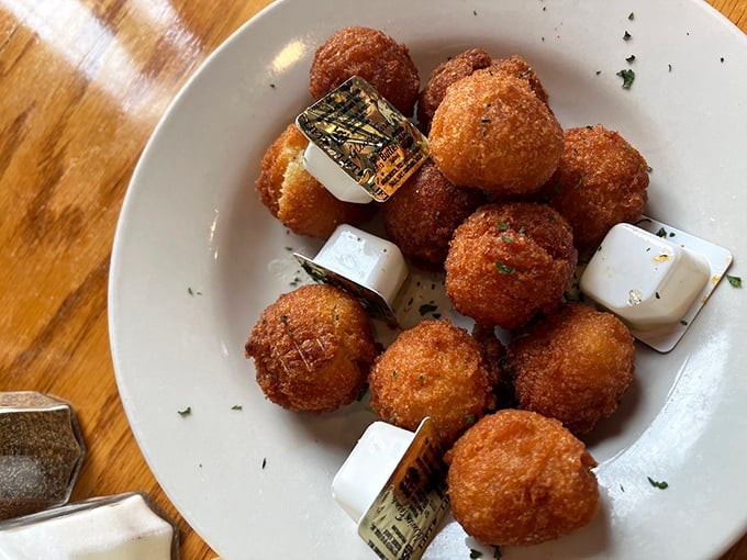These golden hush puppies aren't just side dishes—they're crispy spheres of cornmeal joy that could easily become your main event.