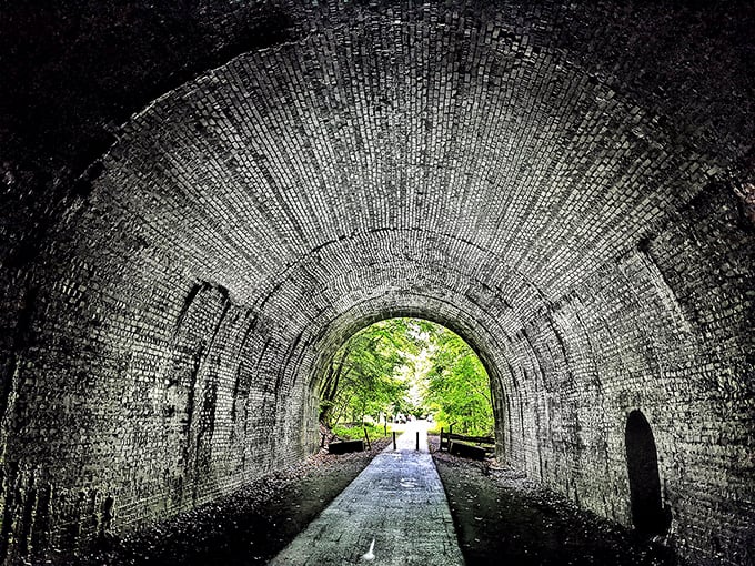 Light at the end of the tunnel isn't just a metaphor here. The brick-lined passage creates a perfect frame for the lush greenery waiting on the other side. 