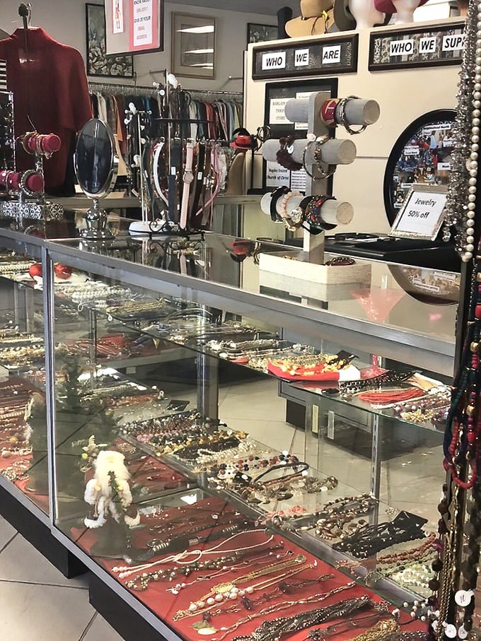 The jewelry counter sparkles with possibility—vintage brooches and modern pieces waiting for their Cinderella moment.