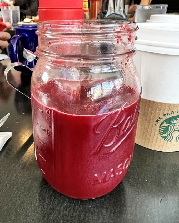 That's not just juice in a Mason jar – it's liquid ruby, promising vitamins and joy with every sip.