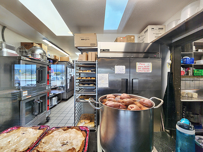 Behind the scenes where pie dreams become reality. That pot of potatoes isn't just food prep—it's potential happiness in starch form.
