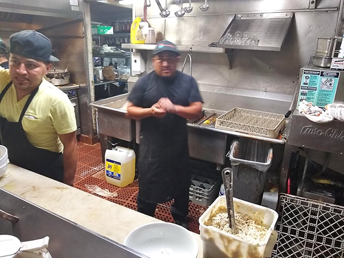 Where the magic happens – kitchen wizards transforming the morning's catch into the evening's memories.