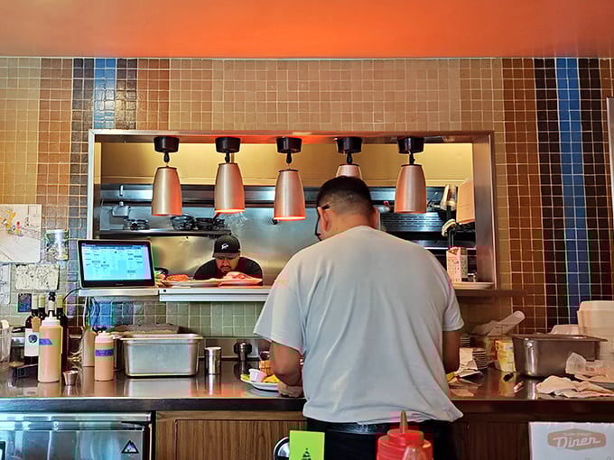 Behind the scenes, where breakfast magic happens—each plate emerging from this window is someone's imminent moment of joy.