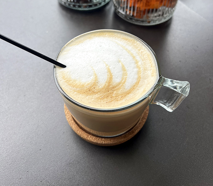 A latte so perfectly crafted it seems almost criminal to disturb that foam art. Almost.
